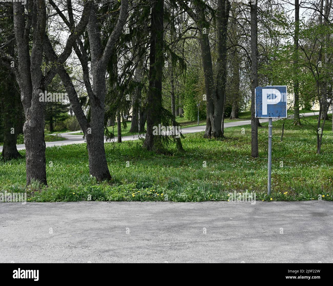 empty parking near park and parking sign, deadpan photography Stock ...