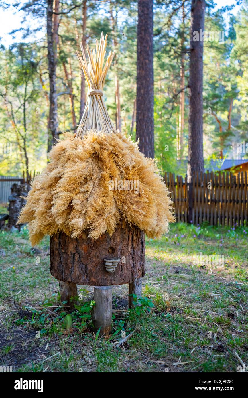 An ancient apiary with artificial hives made of straw and tree bark ...