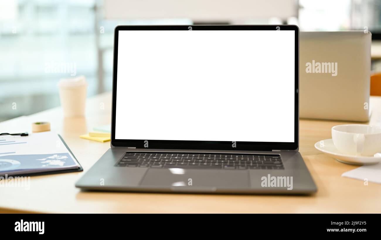 Notebook laptop computer white screen mockup and office stuff on ...