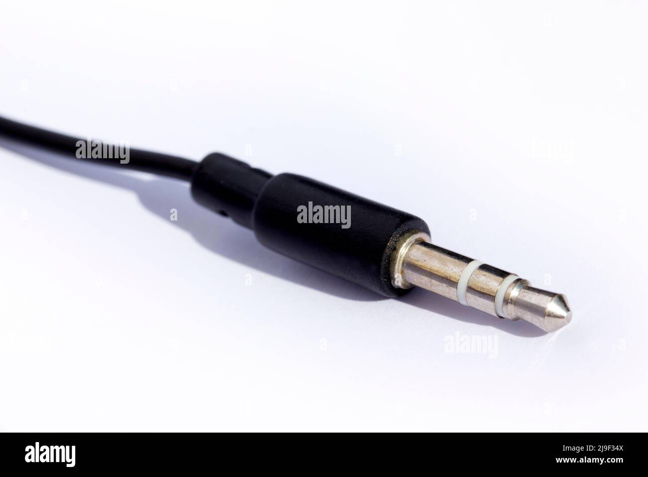 Audio mini jack plug on white background Stock Photo - Alamy