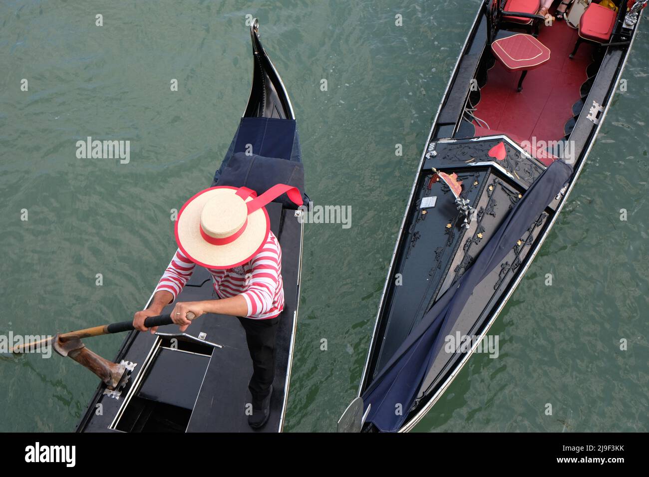 Gondolas and Gondolier Stock Photo - Alamy