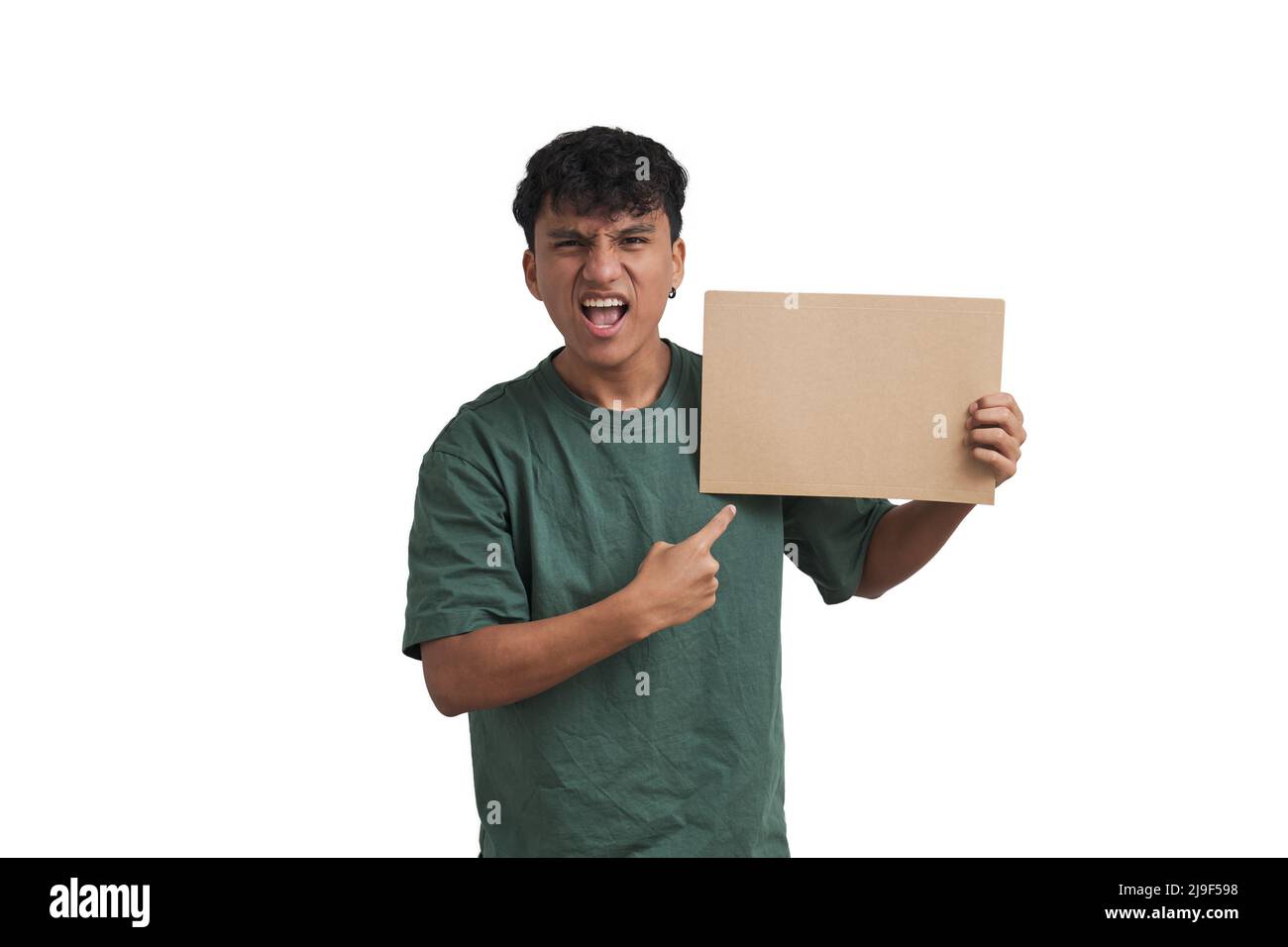 Young peruvian man screaming angry pointing at a board, isolated Stock ...