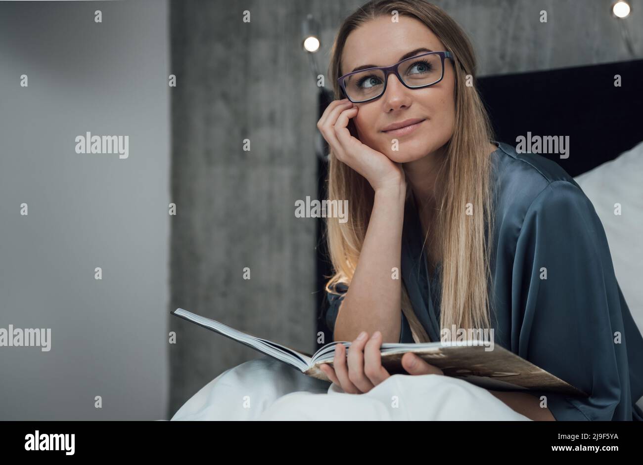 Portrait of a Nice Female Wearing Glasses Reading Interesting Book ...