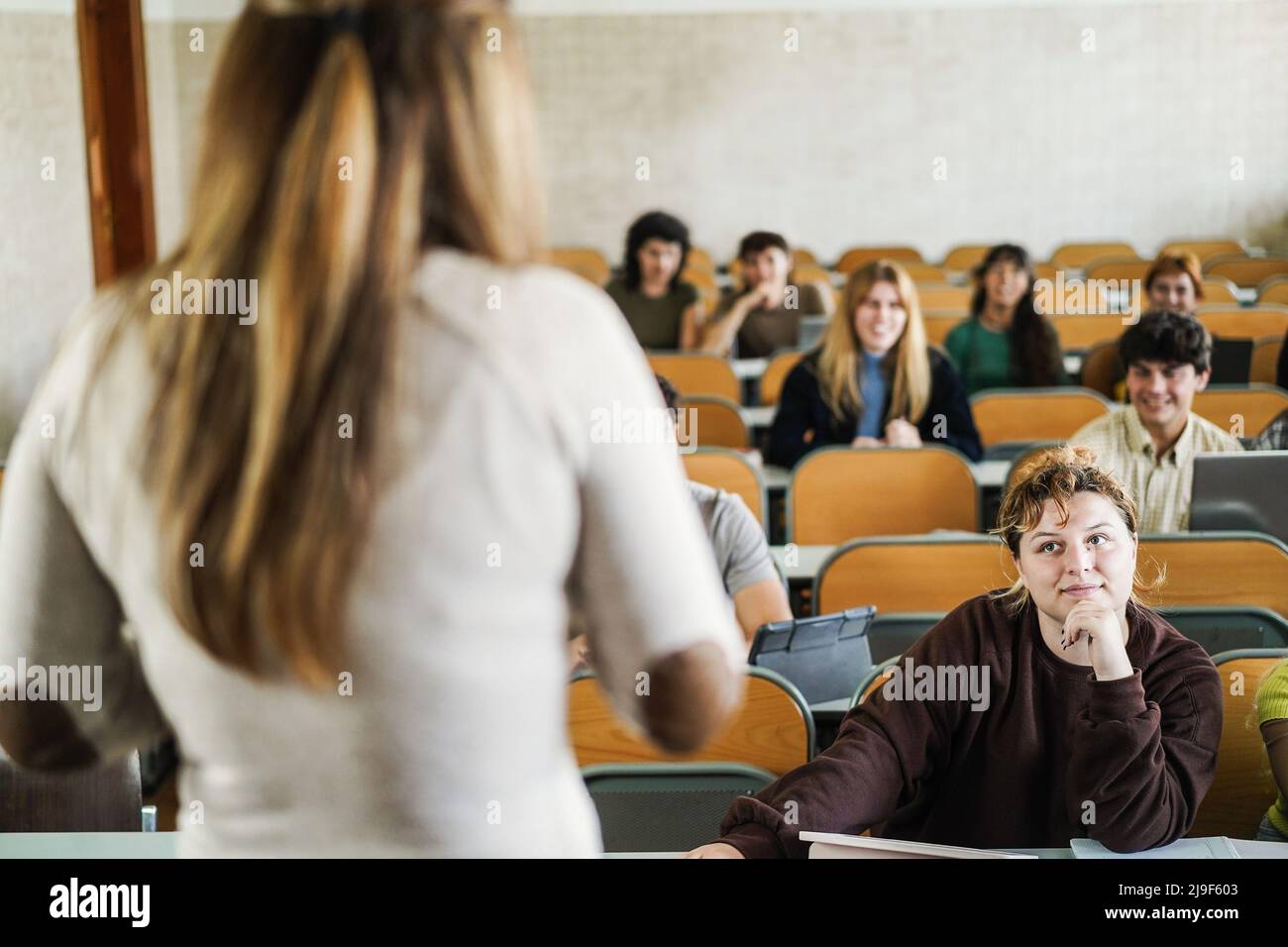 Young students working with tablets inside classroom at school ...