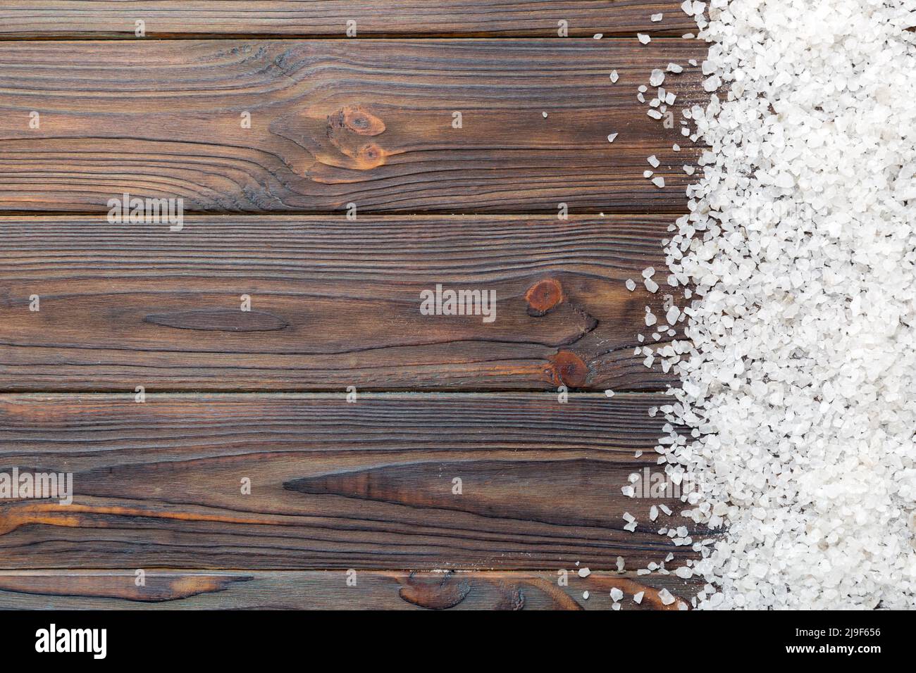Background from white sea salt. Coarse rock salt texture witth copy ...