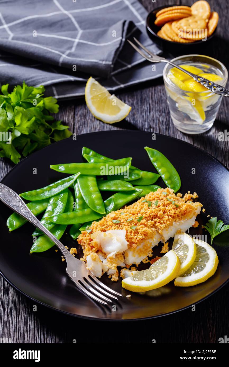 Baked Haddock with Crackers butter toppings served with boiled snow ...