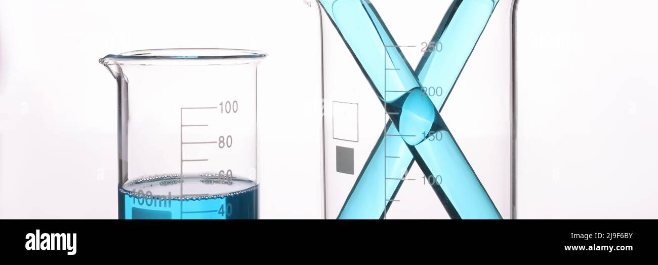 Liquid in transparent measuring vessels, close-up Stock Photo - Alamy