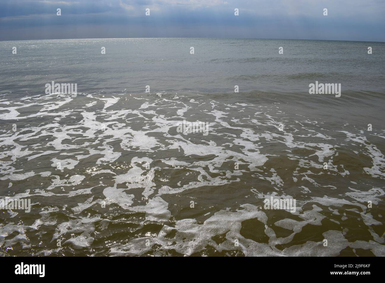 Beautiful landscape - turquoise colored sea water, sand, sky. The waves ...