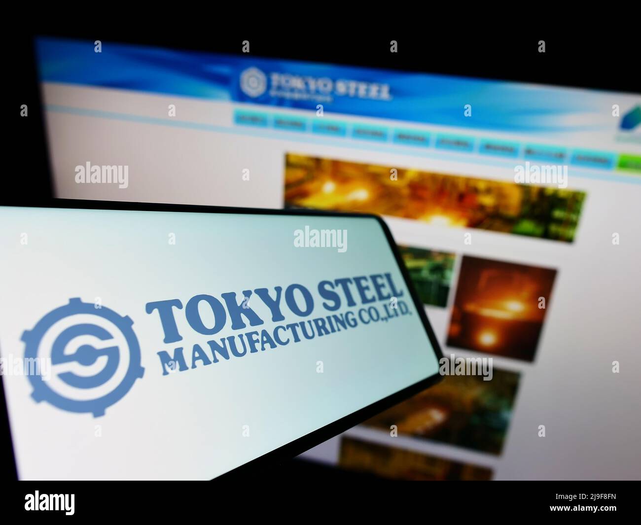 Smartphone with logo of Japanese company Tokyo Steel Co. Ltd on screen ...