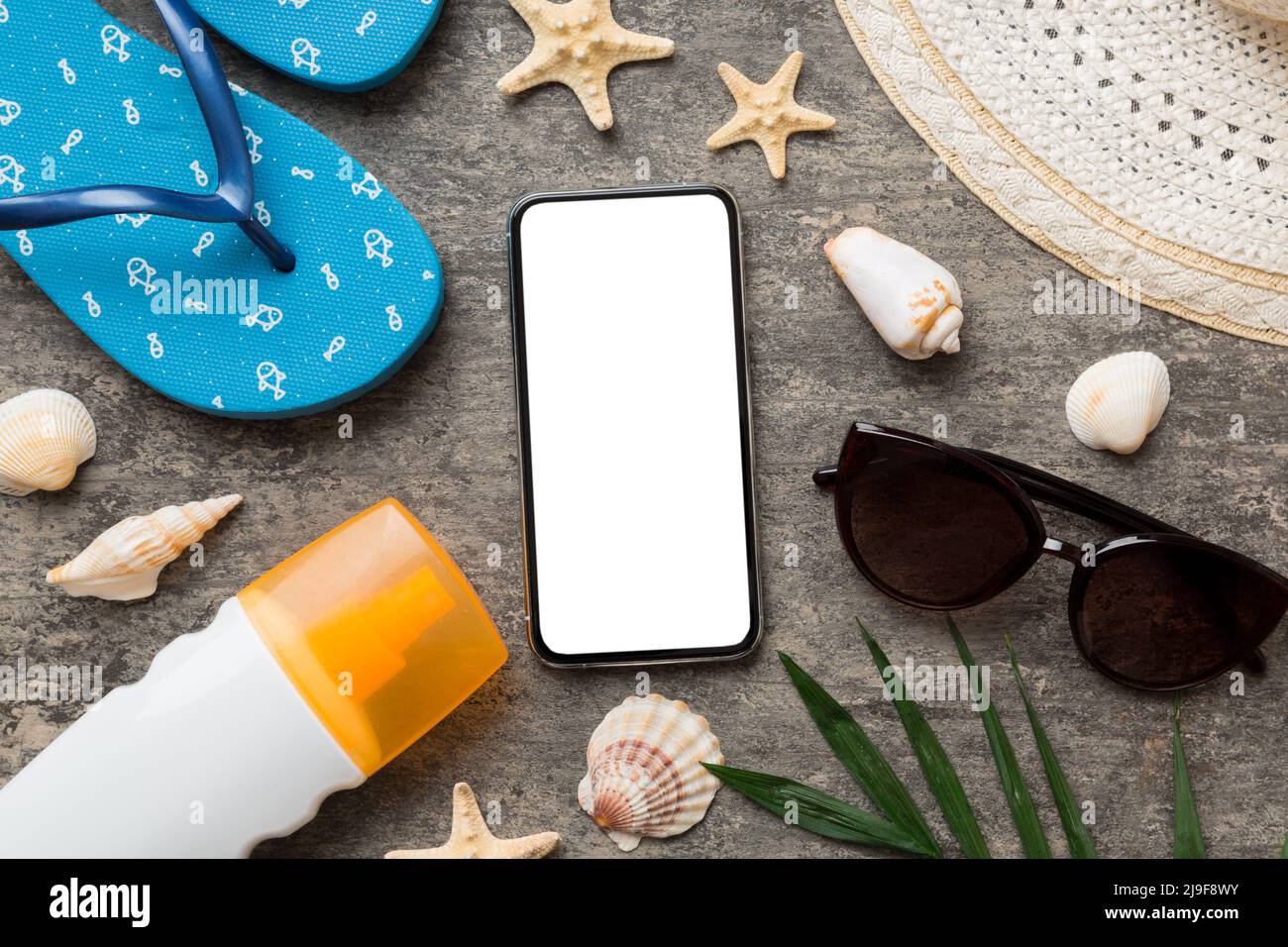 Flat lay composition with Phone and beach accessories on colored ...