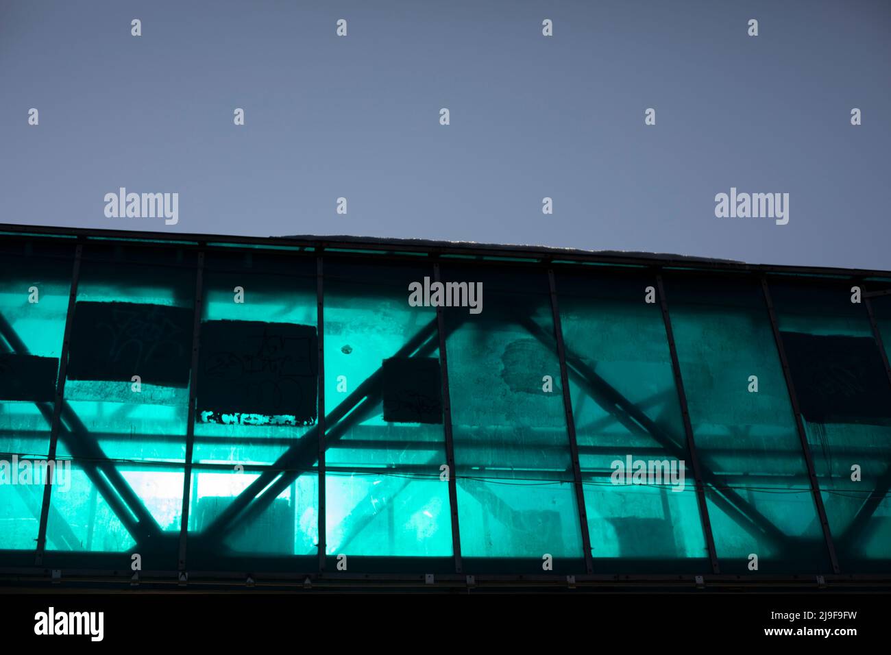 Tunnel is blue. Details of city's architecture. Pedestrian crossing ...