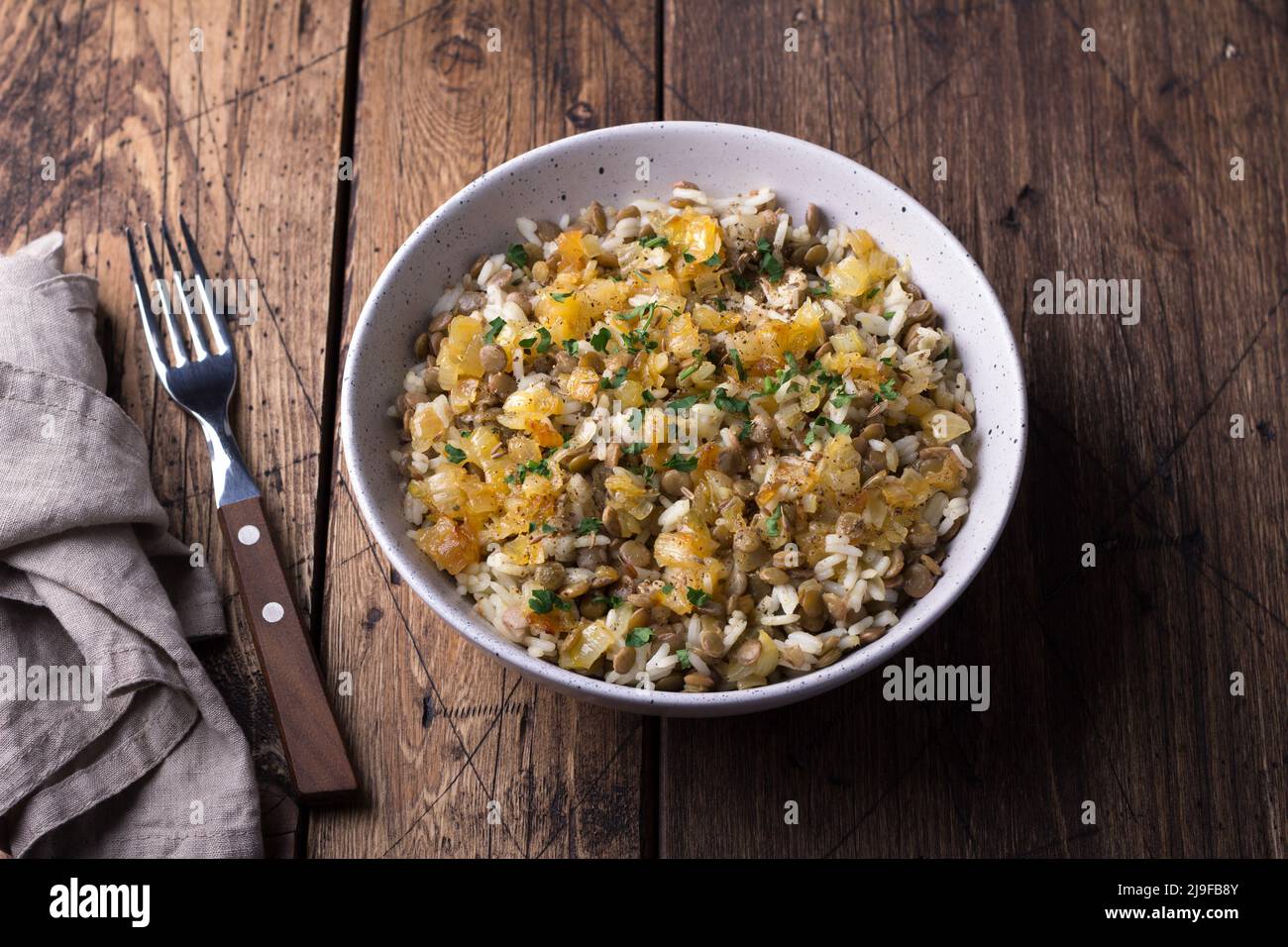 Traditional Middle Eastern dish, Mujadara of lentils, rice and fried ...
