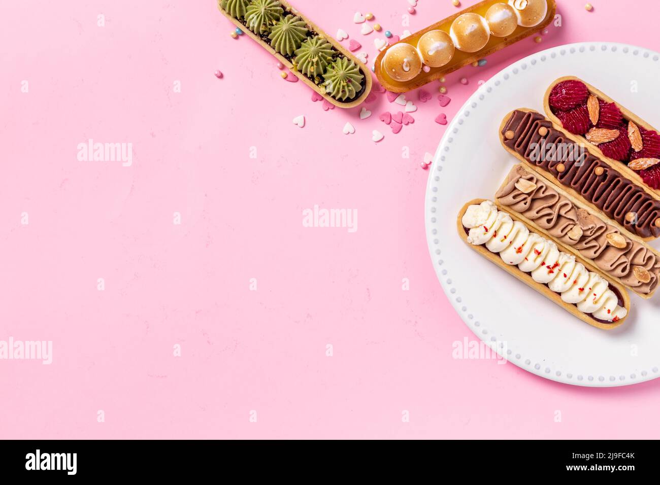 Bakery banner background of eclairs colorful topping Stock Photo - Alamy