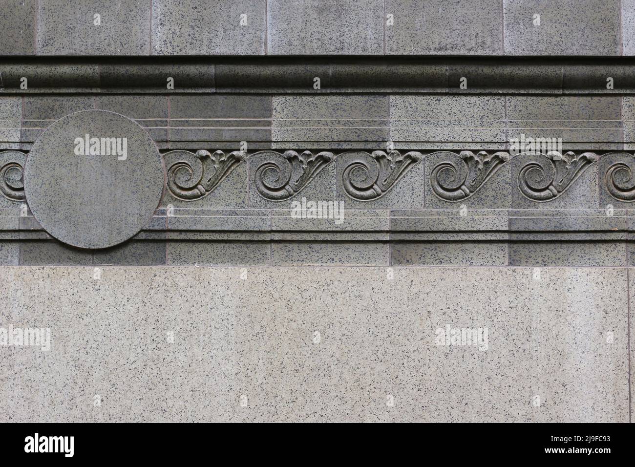 An art deco wave pattern on a vintage downtown skyscraper building ...