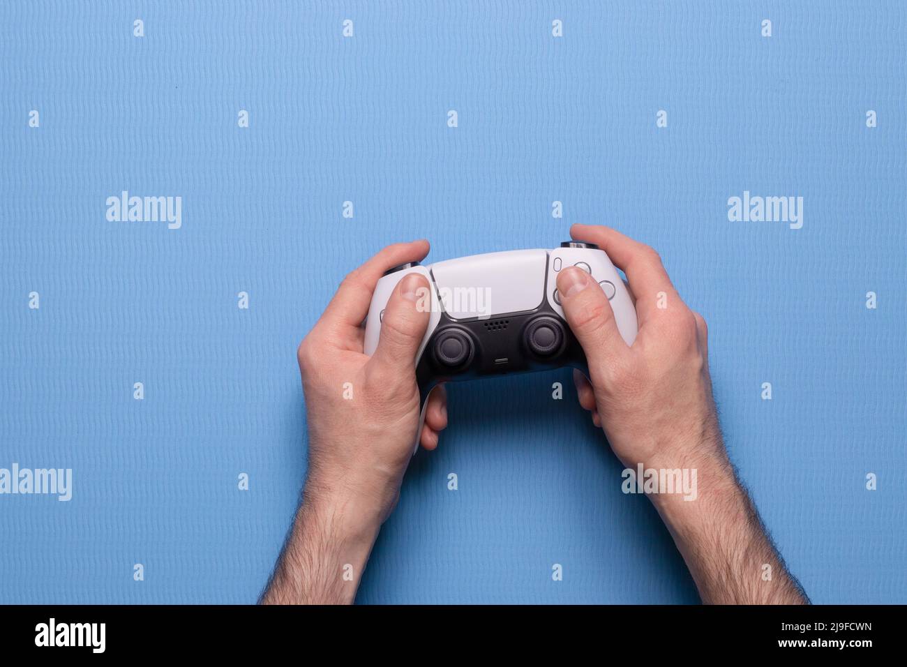 Hand hold new joystick. Gamer play game with gamepad controller. Gaming ...