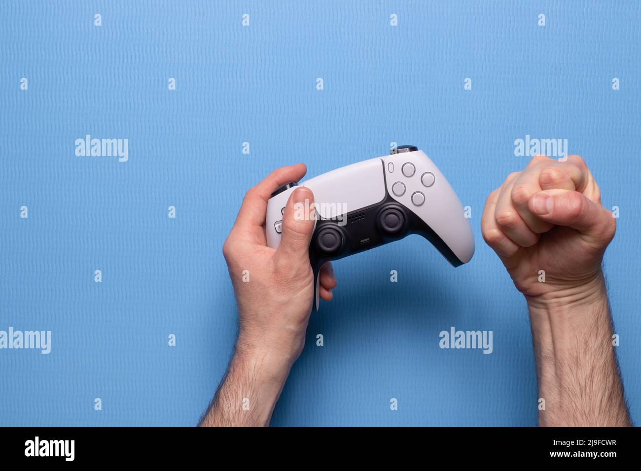 Hand hold new joystick. Gamer play game with gamepad controller. Gaming ...