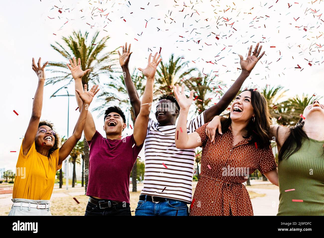 Diverse happy young friends having fun together on summer party Stock ...