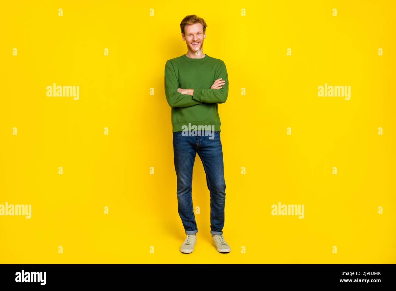 Full length photo of cute attractive guy dressed green sweater arms ...