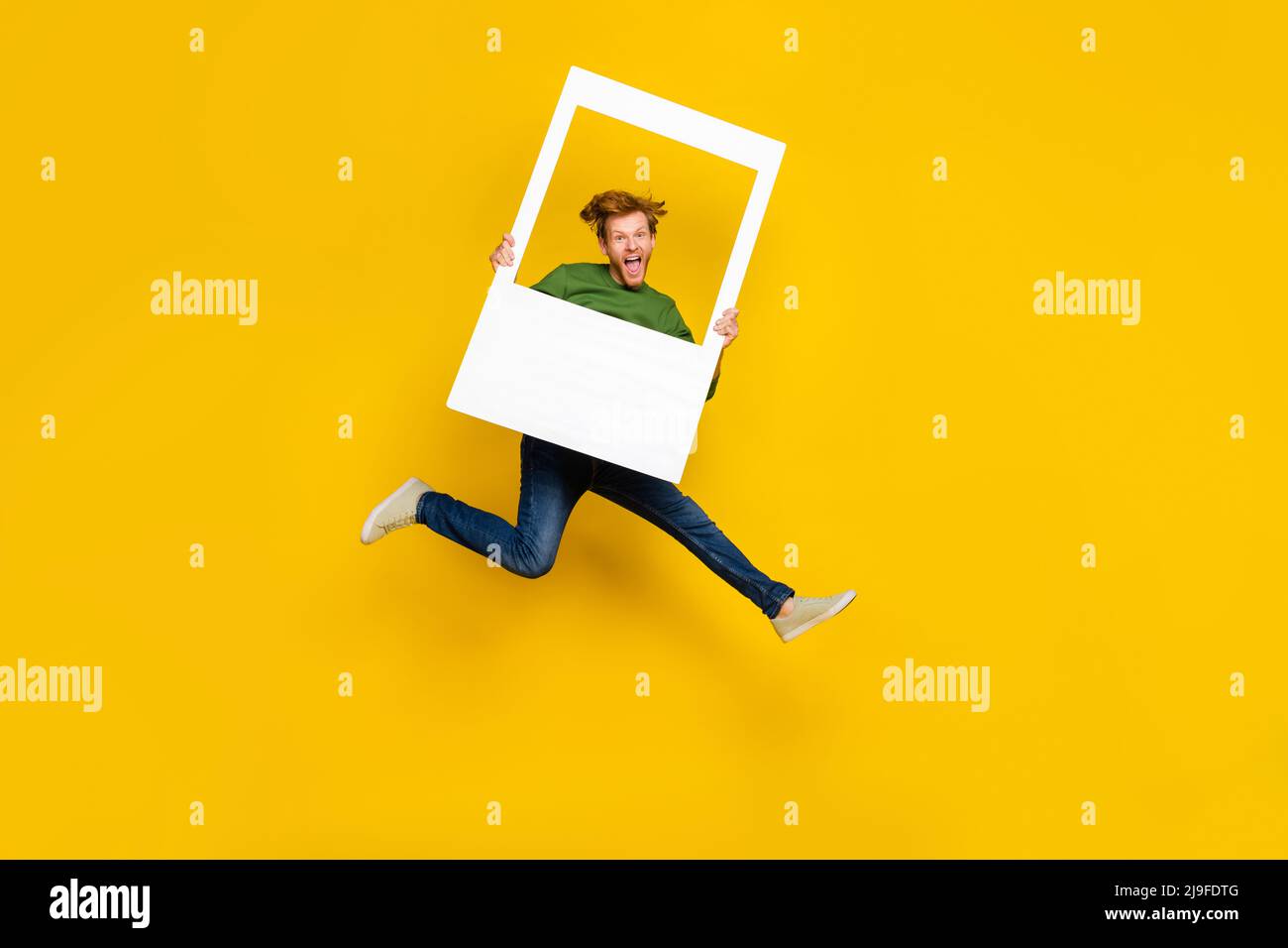 Full length photo of funny excited guy dressed sweater holding white ...