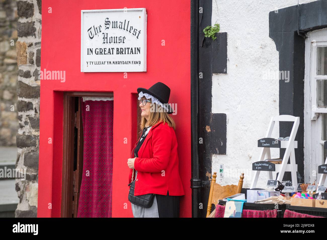 Female tour guide dressed in traditional Welsh costume standing outside ...