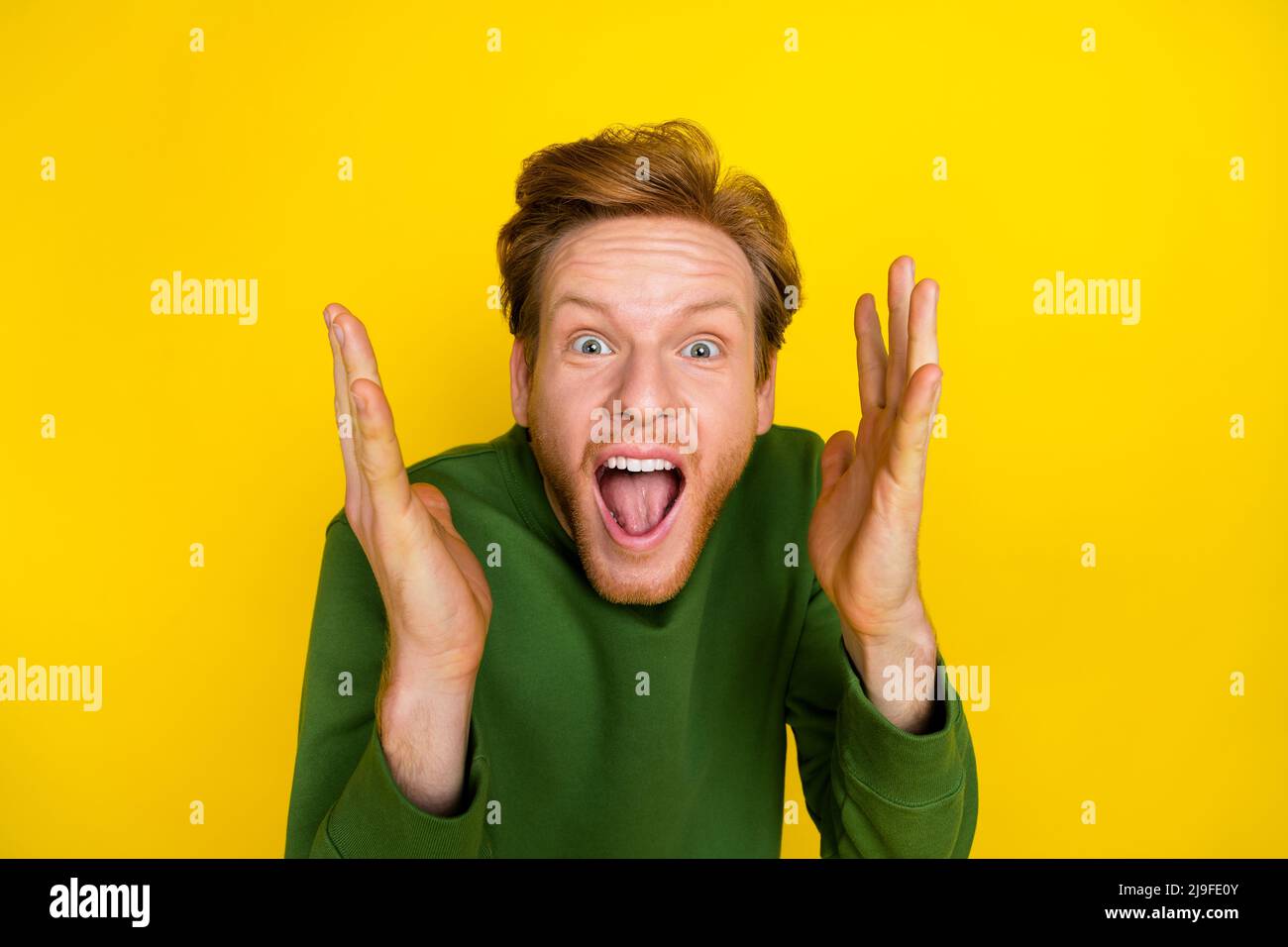 Photo of funky impressed guy dressed green sweater open mouth rising ...