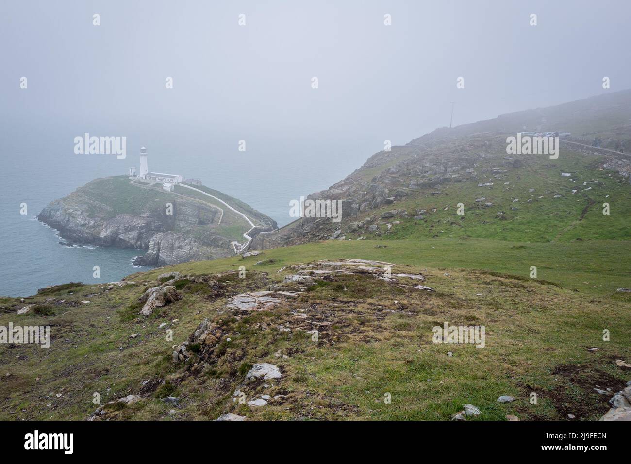 South Stack Lighthouse, Holy Island, Anglesey, Wales, on a cold, windy ...