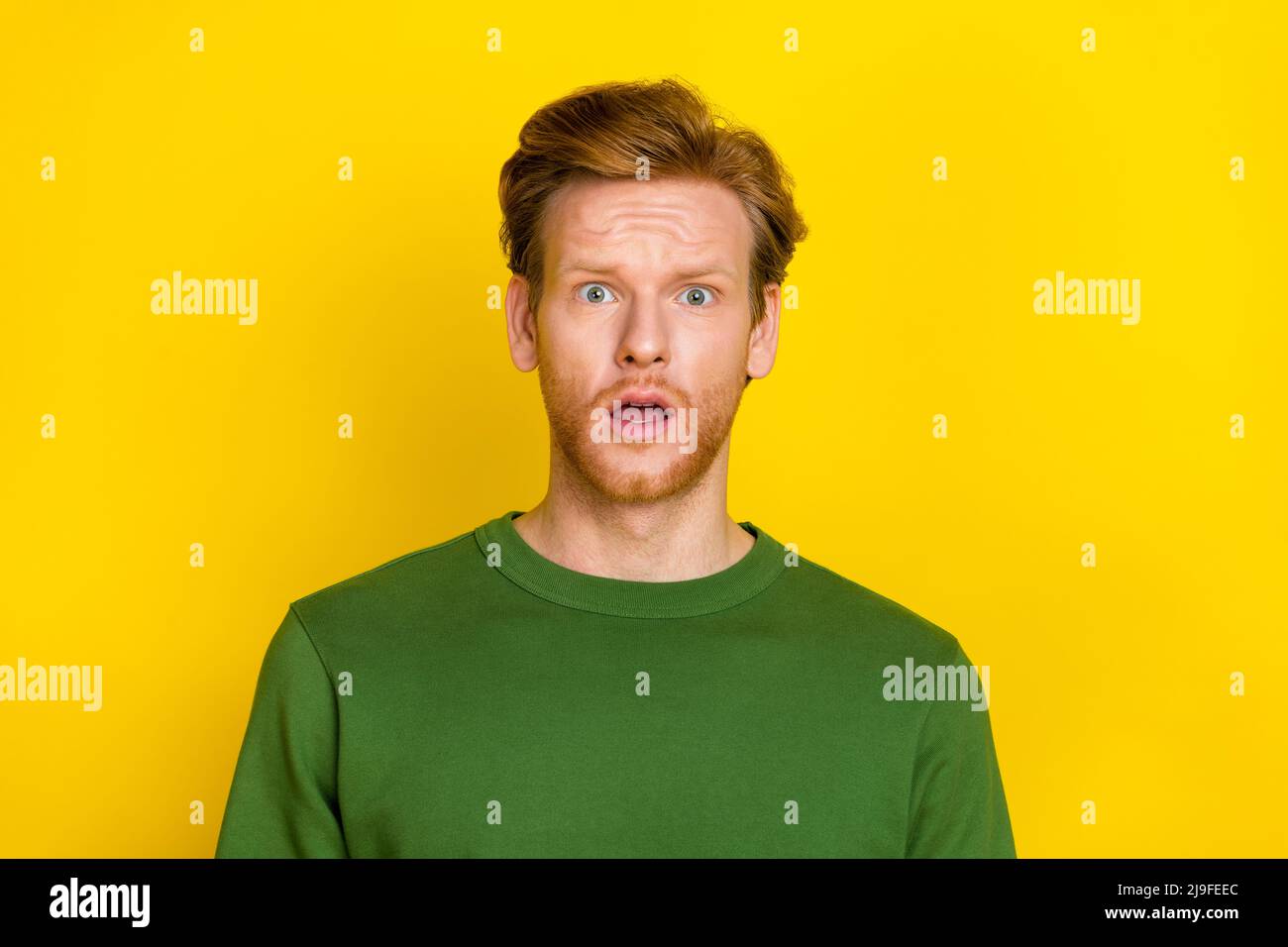 Photo of scared funky guy dressed green sweater big eyes open mouth ...