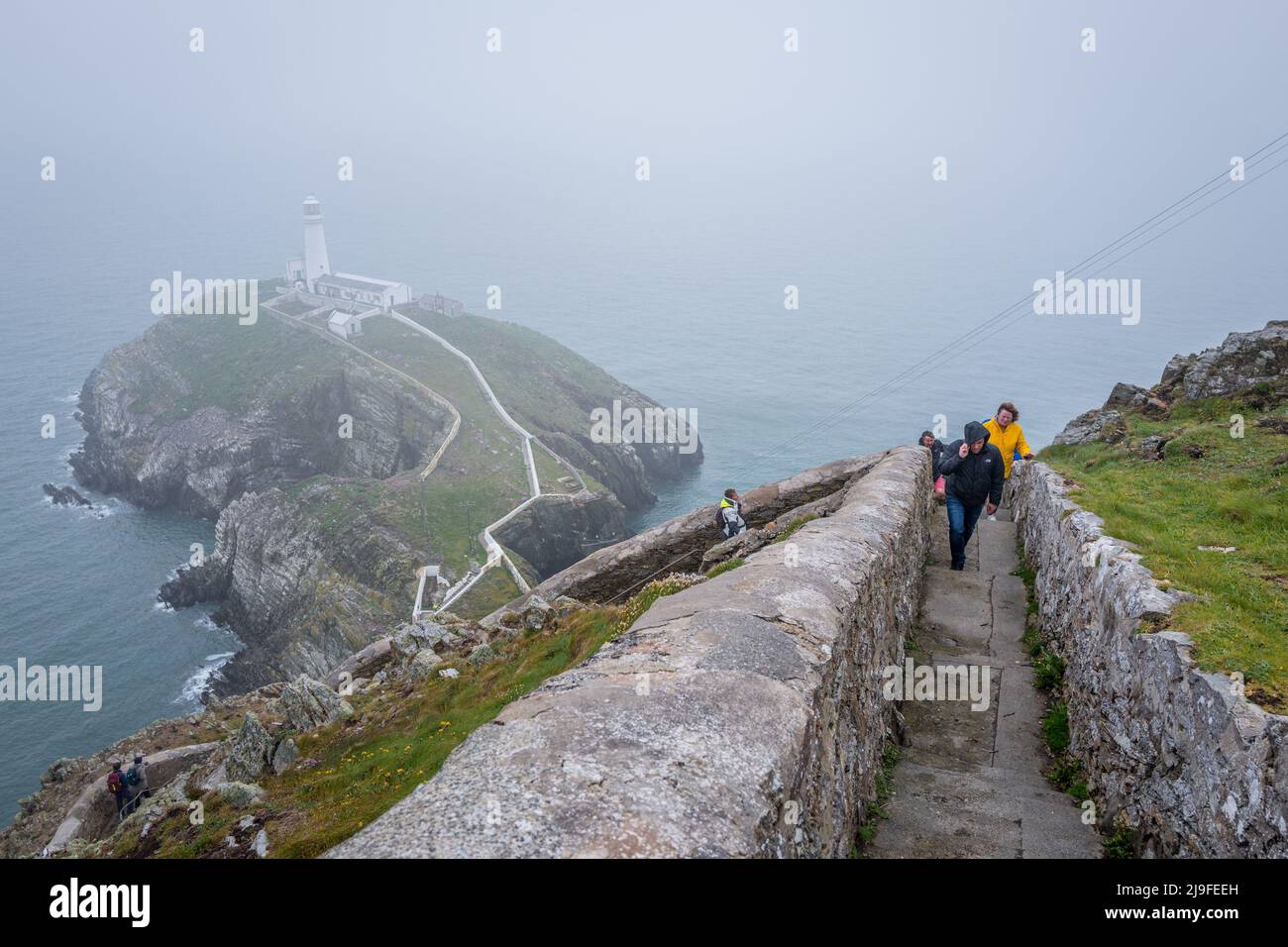 South Stack Lighthouse, Holy Island, Anglesey, Wales, on a cold, windy ...