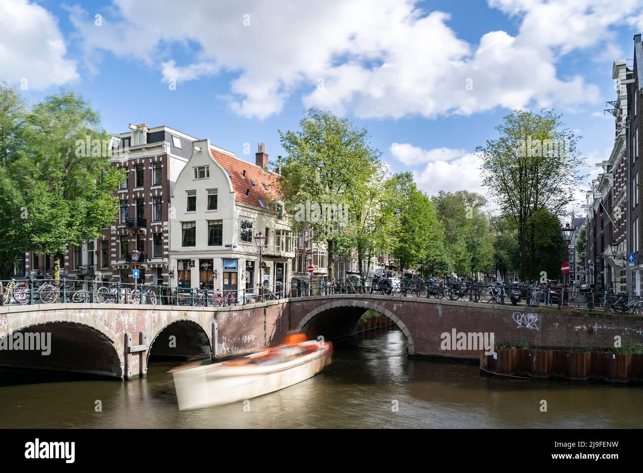 Amsterdam, Netherlands bridges and canals during a sunny day Stock ...