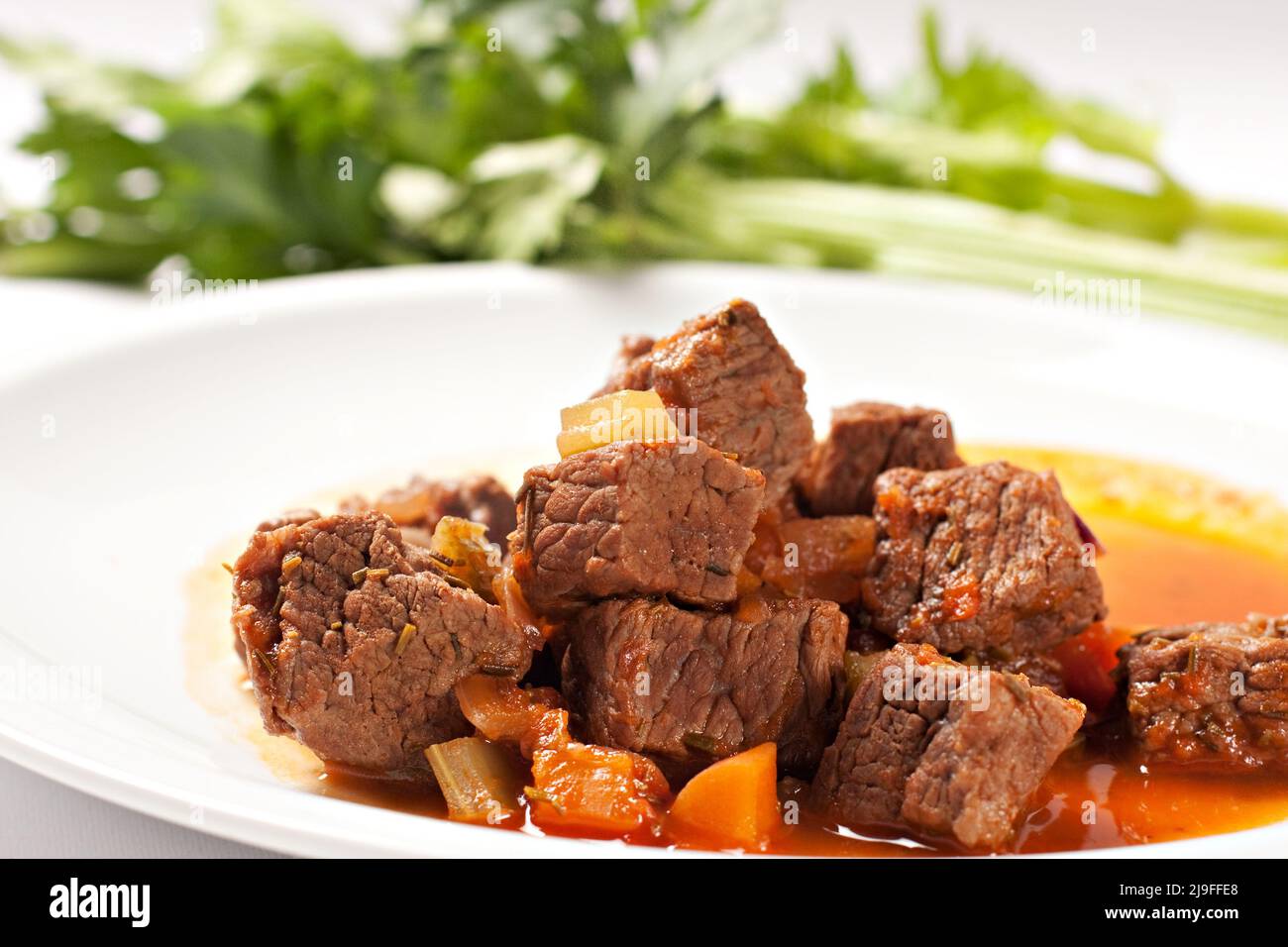 Hot beef stew on a plate. High quality photo Stock Photo - Alamy