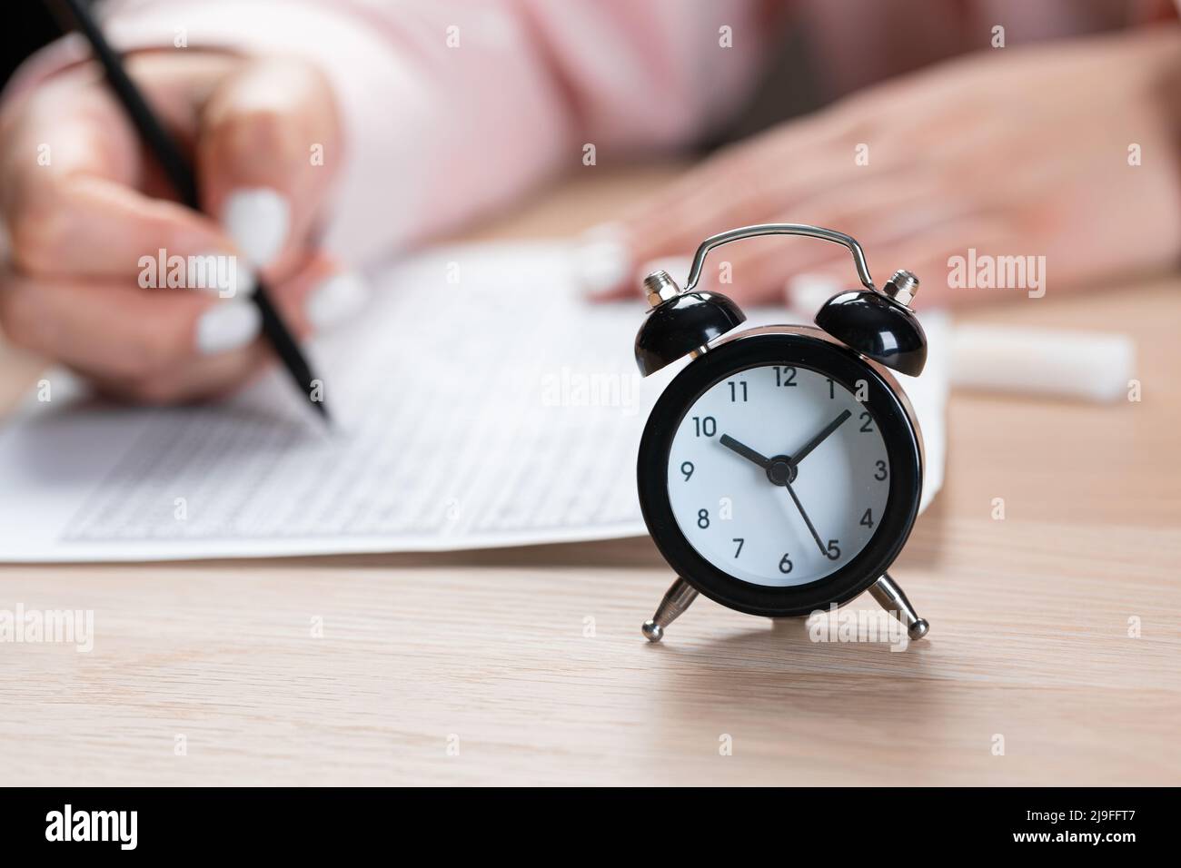 alarm clock for a student writing exams, taking an exam room with a ...