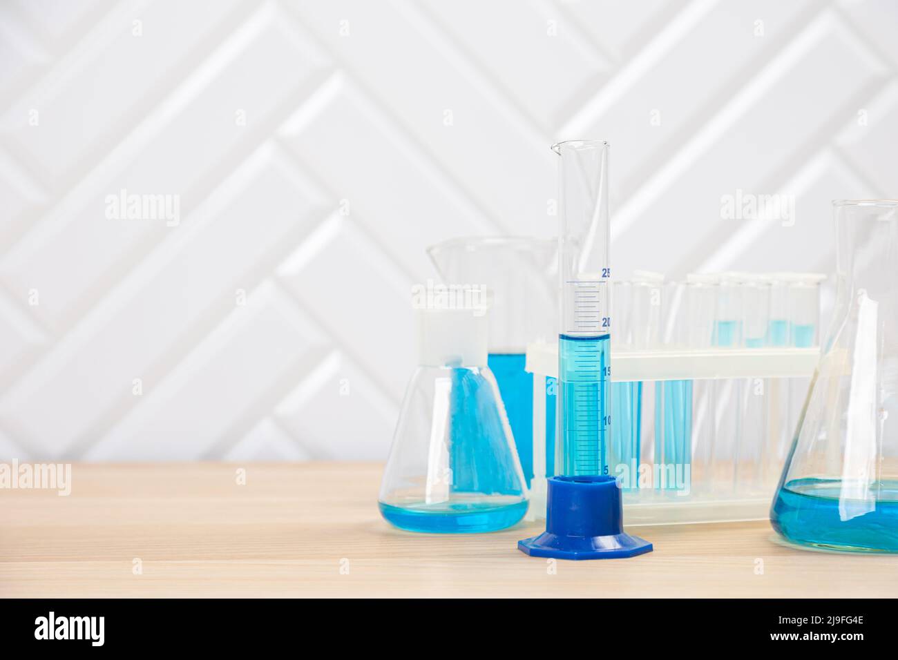 Laboratory glassware with test tubes. flasks, dropper, petri dishes ...