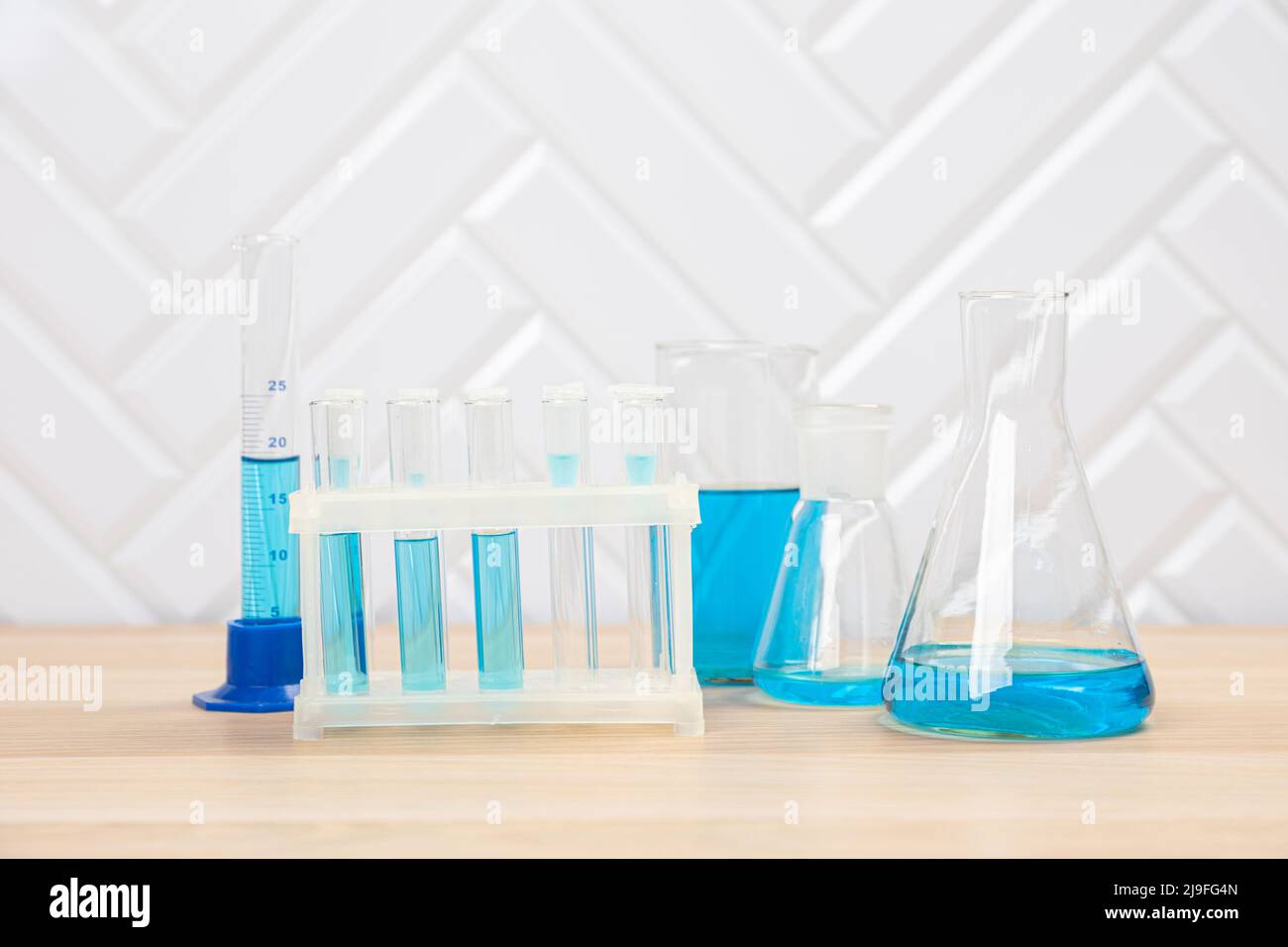 Laboratory glassware with test tubes. flasks, dropper, petri dishes ...