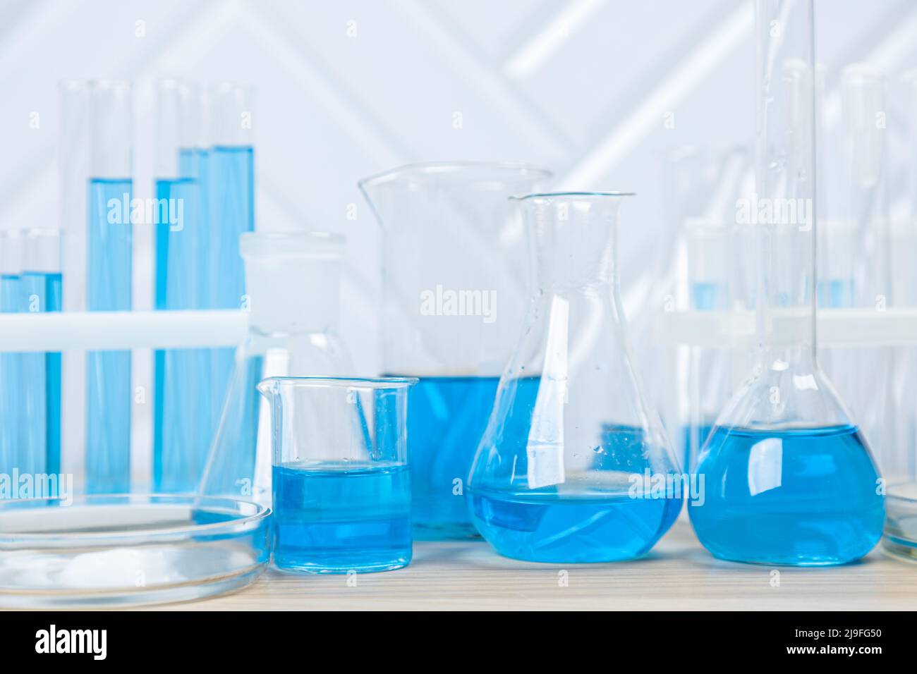 Laboratory glassware with test tubes. flasks, dropper, petri dishes ...