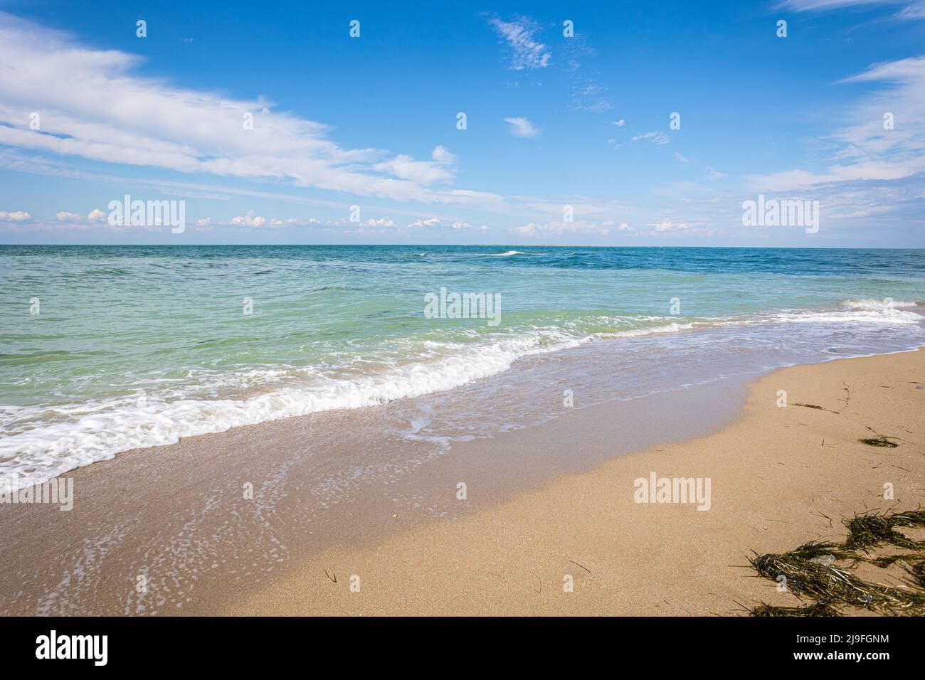 Amazing beach with endless horizon .Soft wave of blue ocean on sandy ...