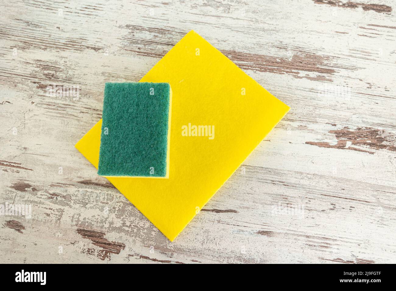 colored rags and sponges for cleaning various surfaces in the kitchen ...