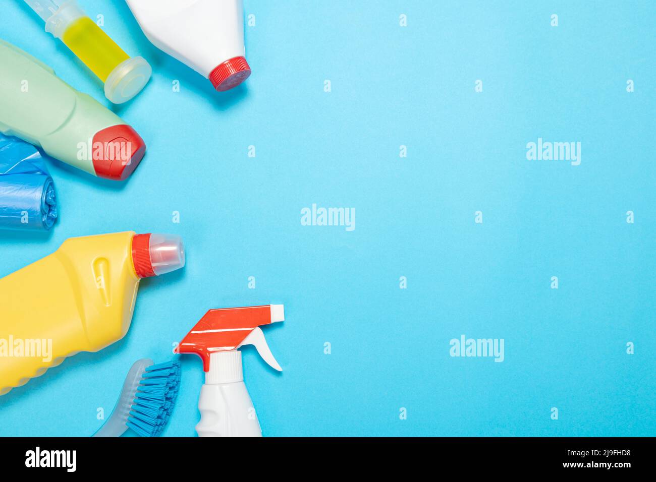 bottles of household chemicals spray and sponges for cleaning and ...