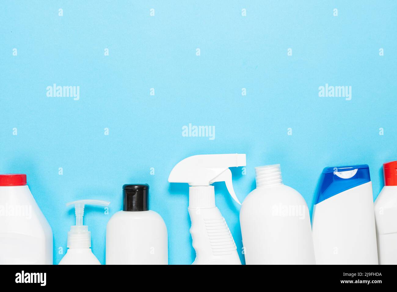 bottles of household chemicals spray and sponges for cleaning and ...