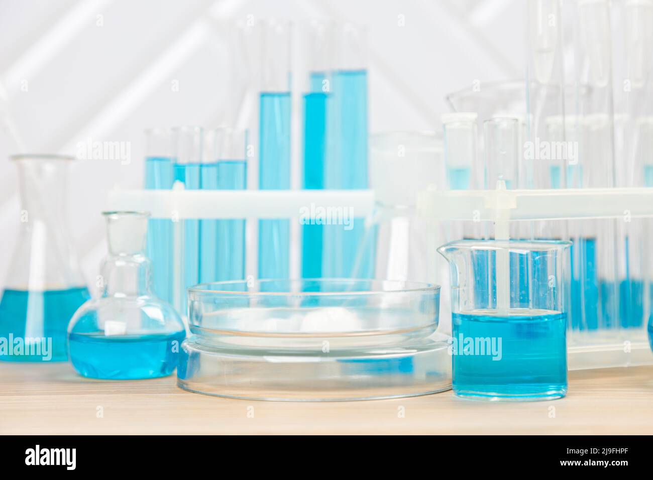 Laboratory glassware with test tubes. flasks, dropper, petri dishes ...