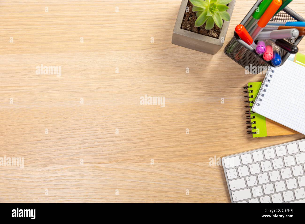 Office table with tablet,smartphone,pen,coffee cup, glasses and cactus ...