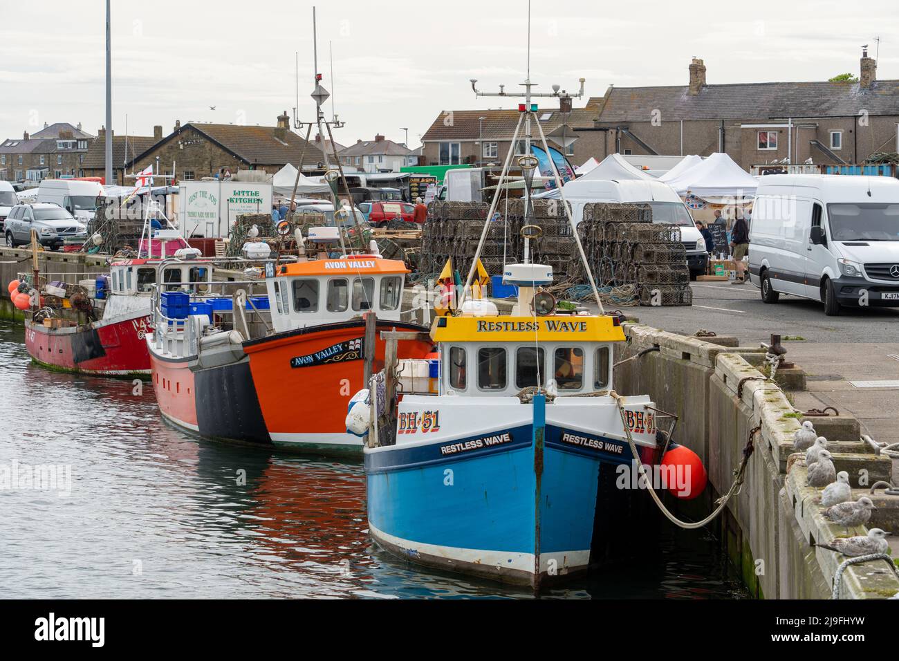 Boats at the harbour of the small fishing town of Amble, Northumberland ...