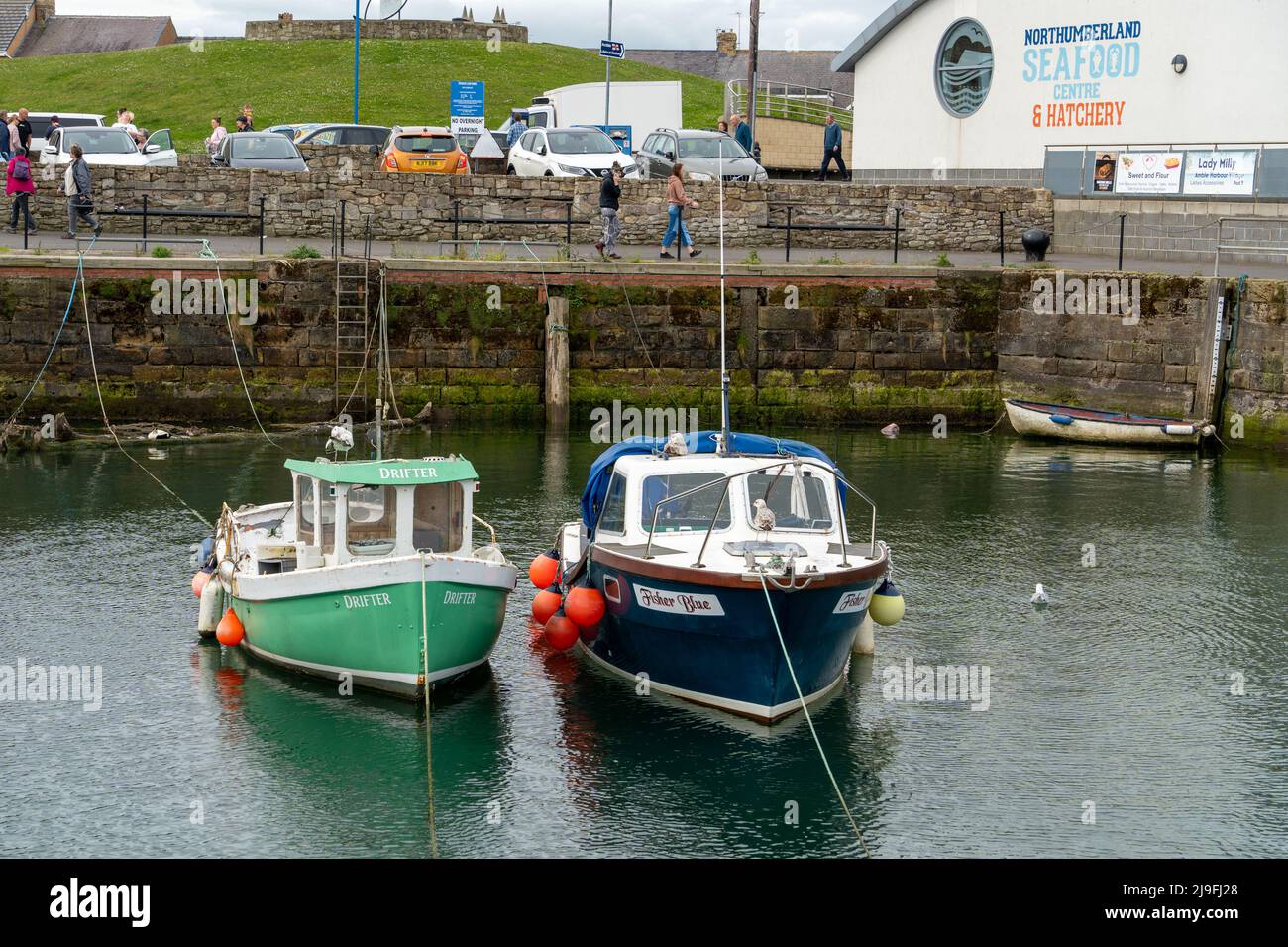 Boats at the harbour of the small fishing town of Amble, Northumberland ...