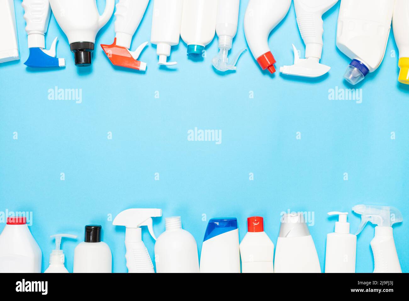 bottles of household chemicals spray and sponges for cleaning and ...
