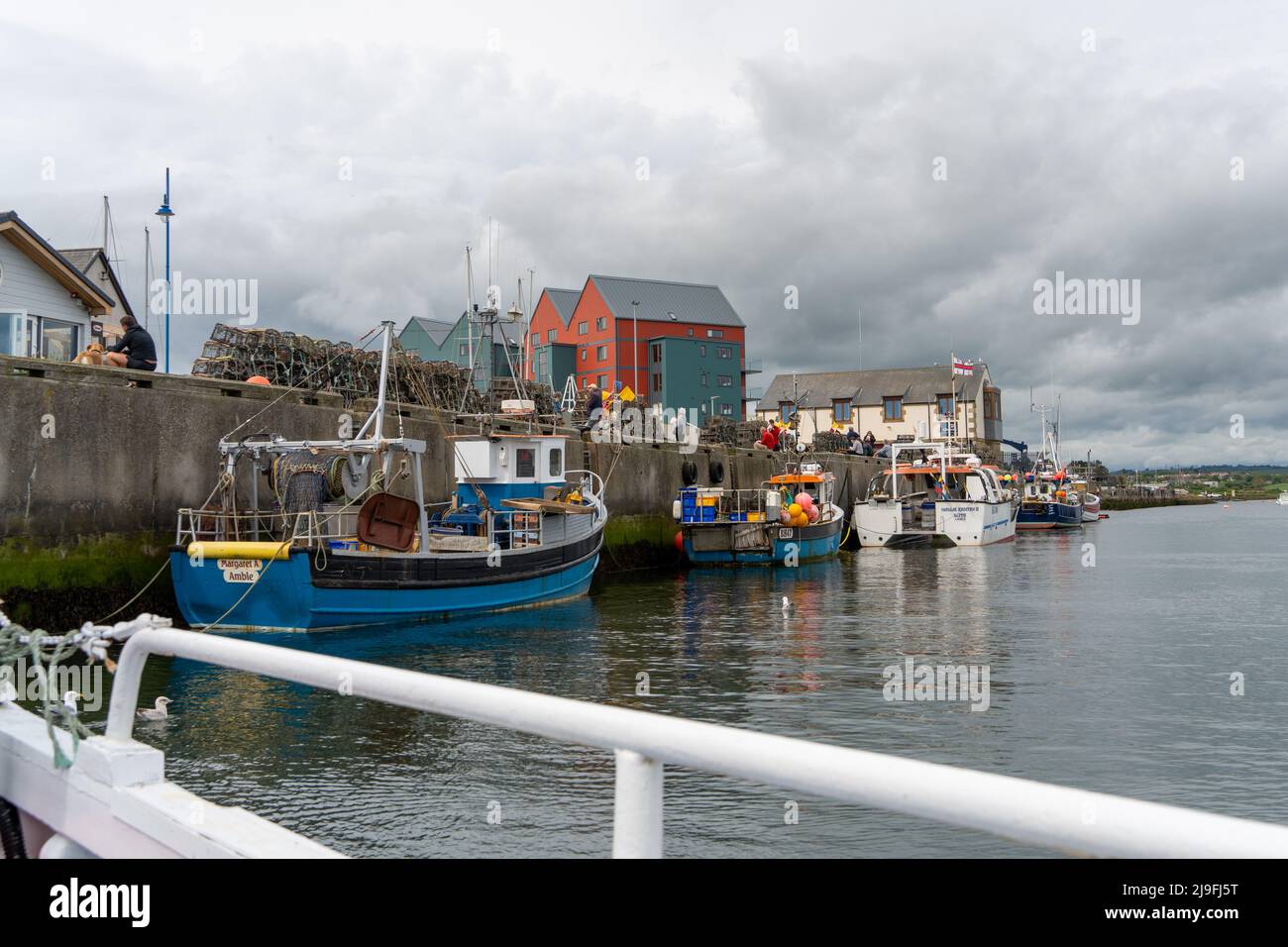 Boats at the harbour of the small fishing town of Amble, Northumberland ...