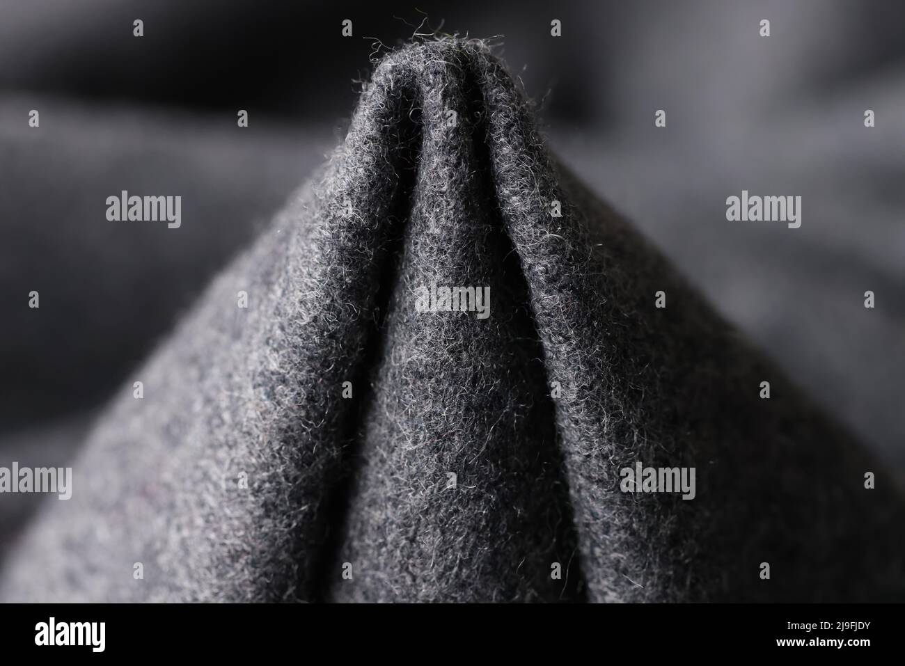 Dark gray woolen fabric in form of cone Stock Photo - Alamy