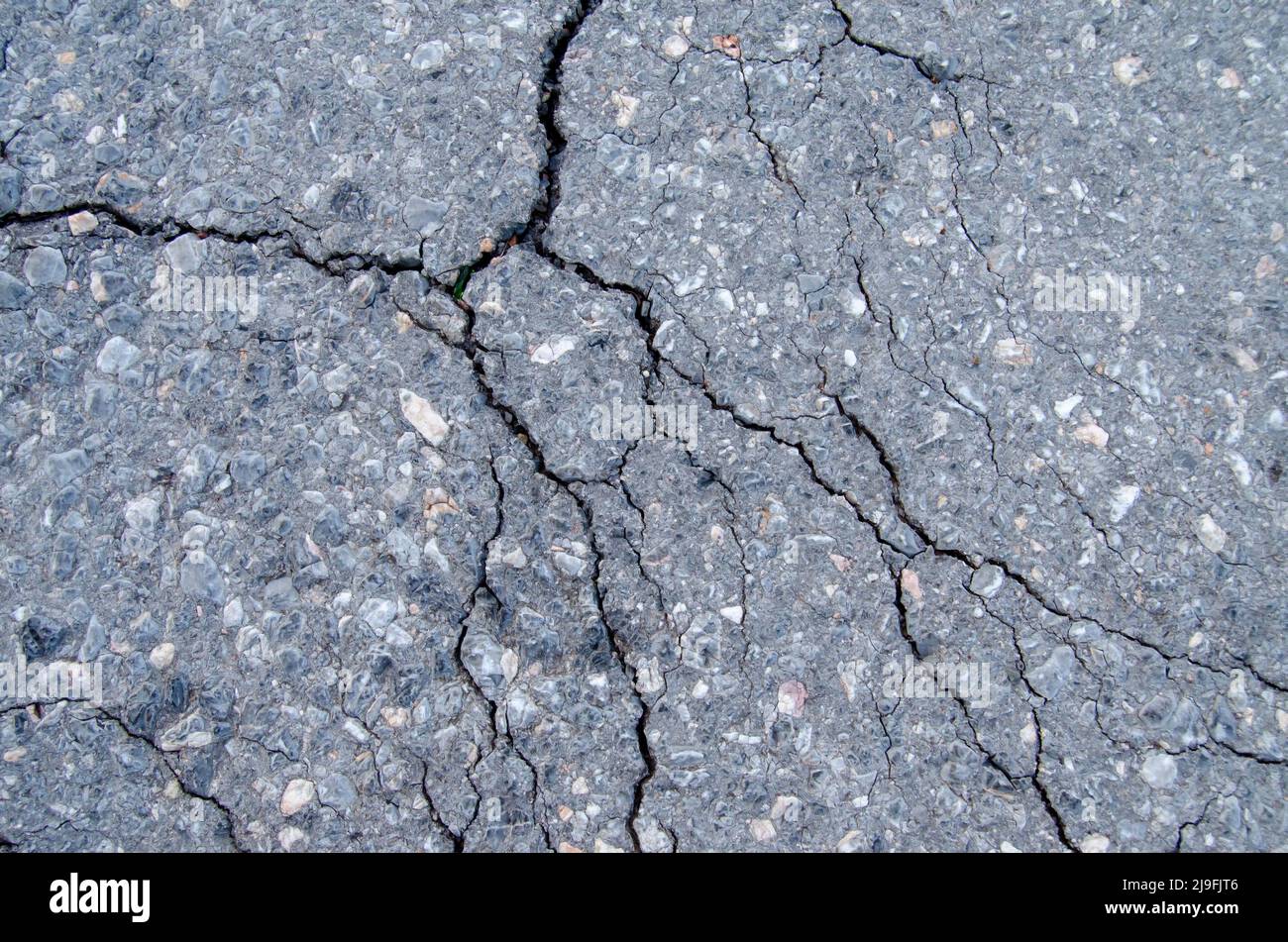 Asphalt crack background texture. Natural slim cracks in concrete for ...