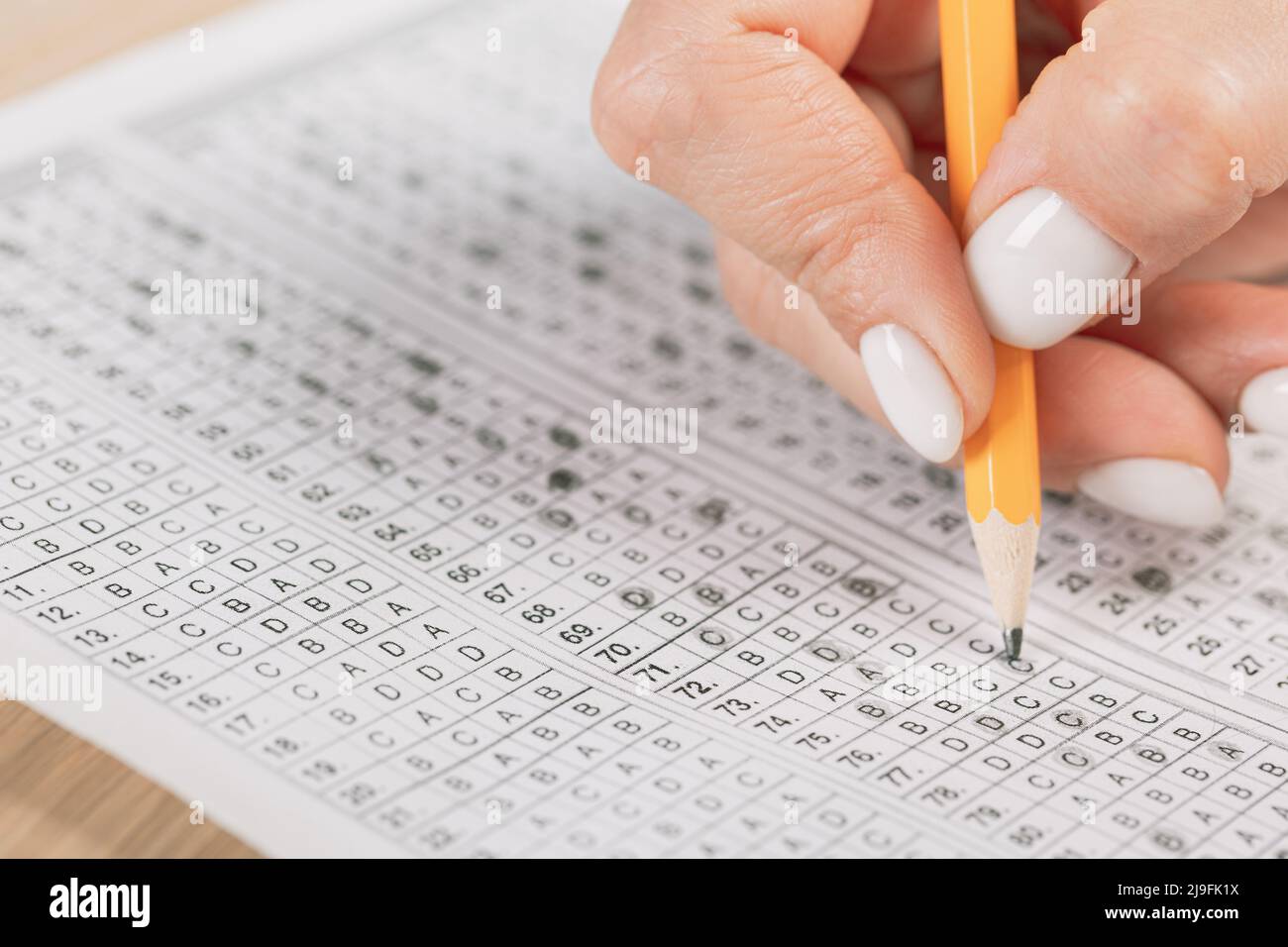Close up of hands of student doing test Stock Photo - Alamy