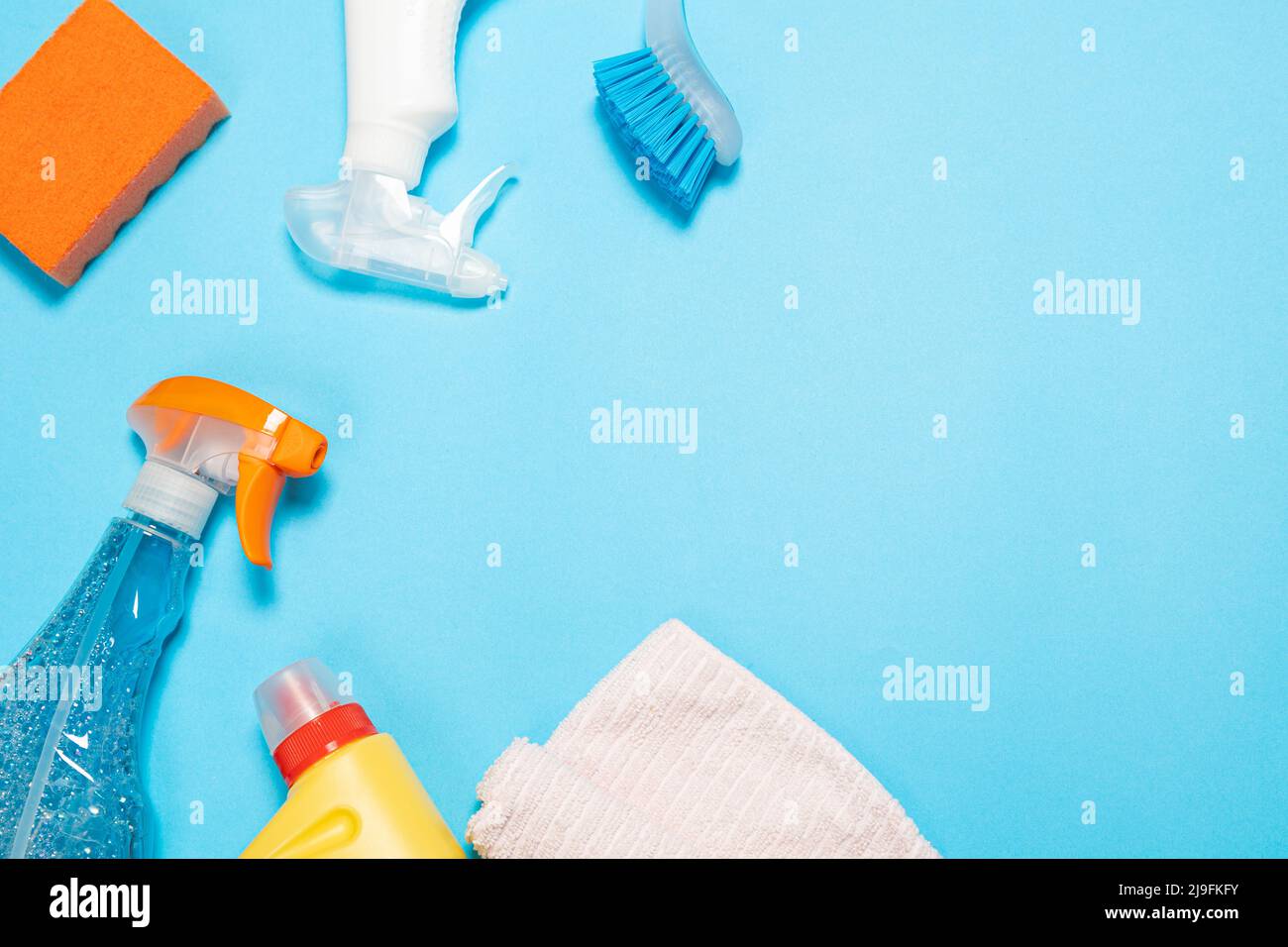 bottles of household chemicals spray and sponges for cleaning and ...