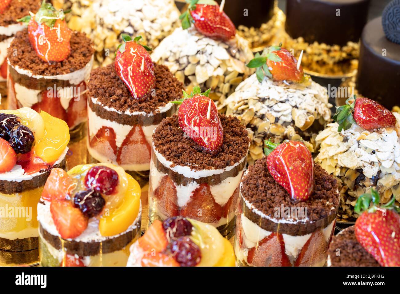 Types of cakes. Cakes on display at the patisserie counter. close up ...