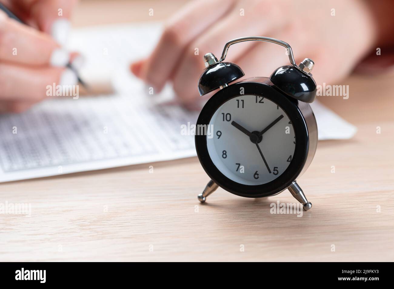 alarm clock for a student writing exams, taking an exam room with a ...